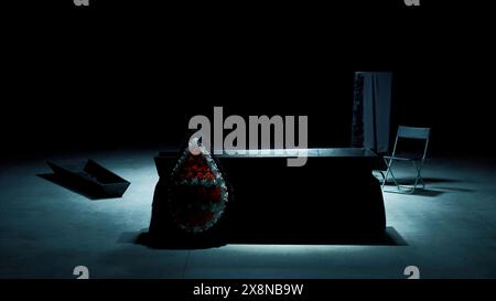 Coffin on stage. Stock footage. Dark scene with empty coffin and ...