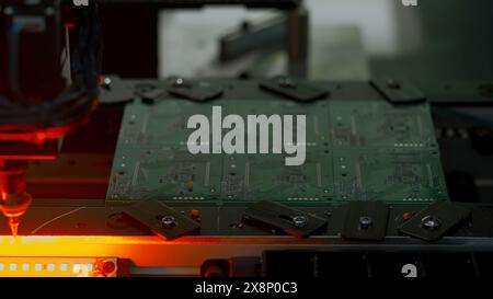 Coating machine for printed circuit board at work. Creative. Close up ...