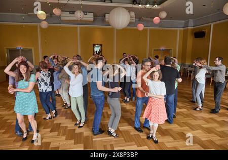 Kiel, Germany. 26th May, 2024. Tim Kahl (r), dance instructor, and his ...