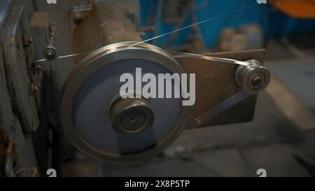 Industrial Rotating Machine with wire. Creative. Rotating coils winding ...