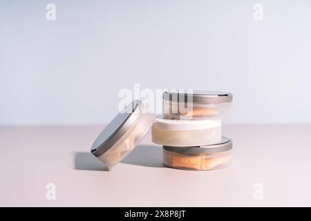 Plastic jars with bags of non-smoking tobacco product under hard light ...