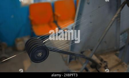 Metal threads rotate on industrial machine. Creative. Rotating shafts ...