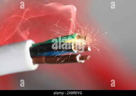 Sparking wiring on blurred background, closeup view Stock Photo - Alamy