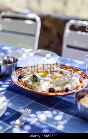 Hummus served in a garden of an old stone house in Catalonia, Spain ...