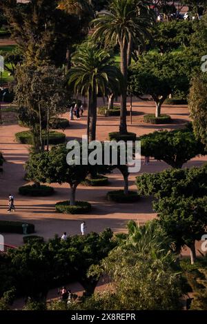 A view of the Parc de la Ligue Arabe with its lush greenery and people ...