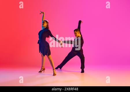 Ballroom dancers in perfect harmony, their fluid movements frozen in ...