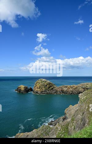 Rocky outcrops and attractive sky on the coast between Porthgain and ...