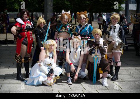 A group of male and female Cosplay people pose for photos at MCM Comic ...