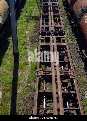 bases of railway cars on the tracks. Empty composition. A train without ...