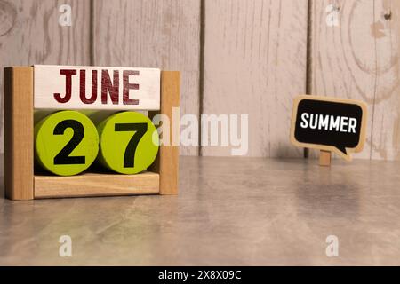 27 june wooden calendar in white background Stock Photo - Alamy