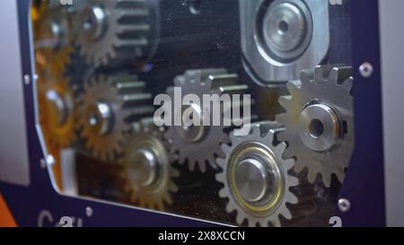 Mechanism with rotating gears. Media. Shiny metal gears rotate in ...