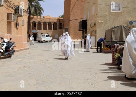 Mozabite women in white haïk in the streets of Ksar El Atteuf, North ...
