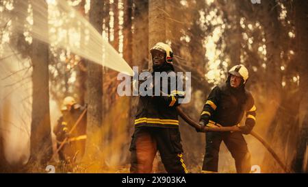 Portrait of a Brave Professional Firefighter Using a Firehose to Fight ...