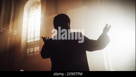Portrait of Christian Priest Raising Hands In Blessing His Congregation ...
