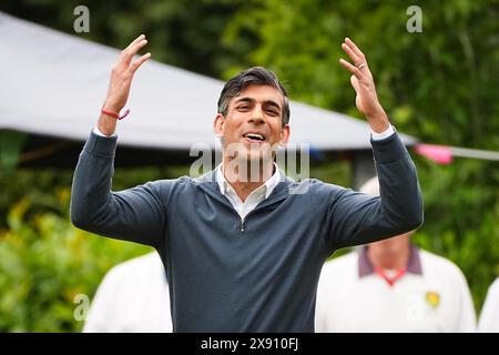 Prime Minister Rishi Sunak playing 'Splat the Rat' at a village fete in ...