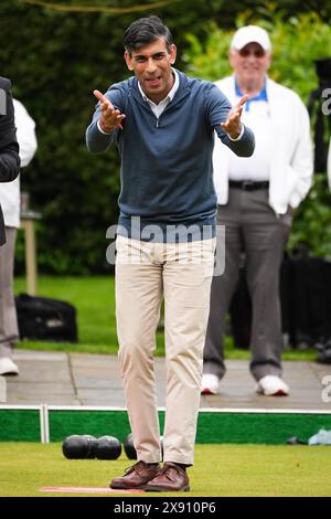 Prime Minister Rishi Sunak playing 'Splat the Rat' at a village fete in ...