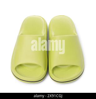 Pair of green rubber slippers isolated on white Stock Photo - Alamy