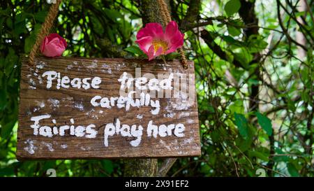 tread carefully, fairies play here sign Stock Photo - Alamy