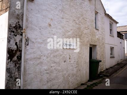 Sign pointing to the Quaker Meeting House in Marazion, Cornwall. The ...