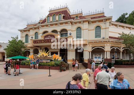 Groups of guests get photos taken in front of the Showstreet Palace ...