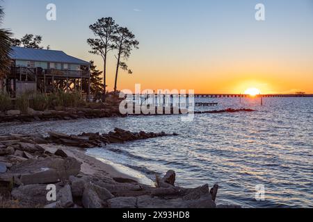 Sunset over the railroad bridge across Bay of Saint Louis from ...