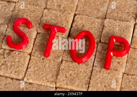 Stop sign background of cane sugar cubes. Concept junk food Stock Photo ...