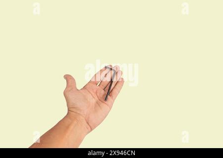 Black male hand offering an allen key isolated no background Stock ...
