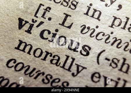 Word vicious on dictionary page, macro close-up Stock Photo - Alamy