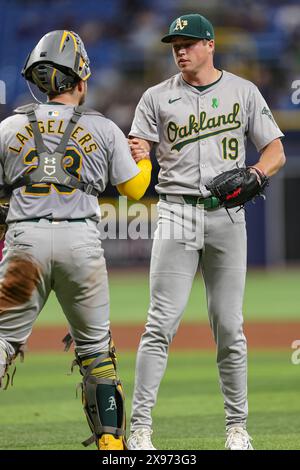 Athletics pitcher Mason Miller (19) throws to a New York Mets batter ...