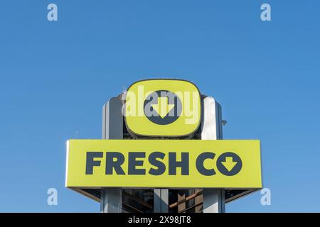 Closeup of FreshCo store sign with the blue sky background. Winnipeg ...