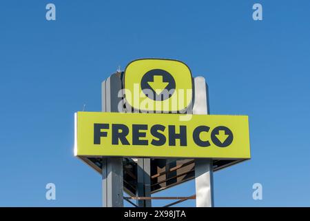 Closeup of FreshCo store sign with the blue sky background. Winnipeg ...