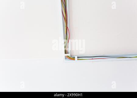 Exposed colourful cables on electrical wire casing base for rewiring ...