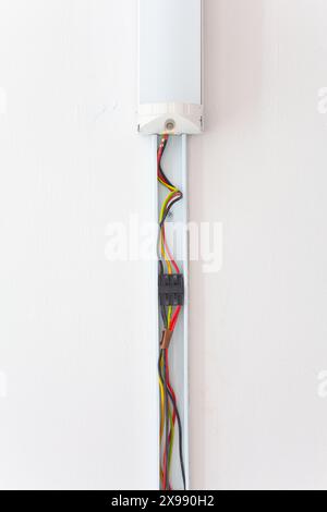 Exposed colourful cables on electrical wire casing holder base for ...