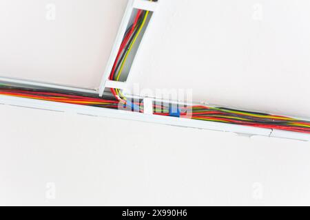 Exposed colourful cables on electrical wire casing base for rewiring ...