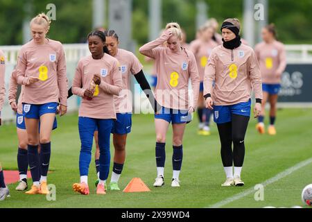 England goalkeeper Hannah Hampton, right, celebrates with teammates ...