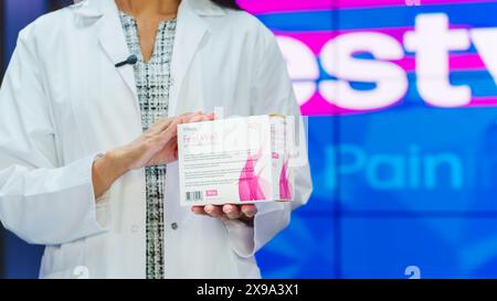 TV Show Product Infomercial: Professional Expert Doctor Holds Package ...