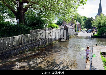 A ford over the river Darent, with a picturesque hump-back bridge ...