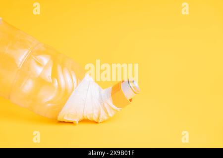 Recycling plastic inhaler bottles on yellow background Stock Photo - Alamy