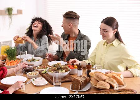 People eating different delicious food at festive Thanksgiving table ...
