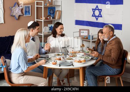 Happy Jewish family having dinner at home Stock Photo - Alamy