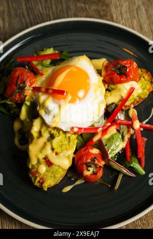 Top down of Avocado toast with fried eggs and vegetables Stock Photo ...