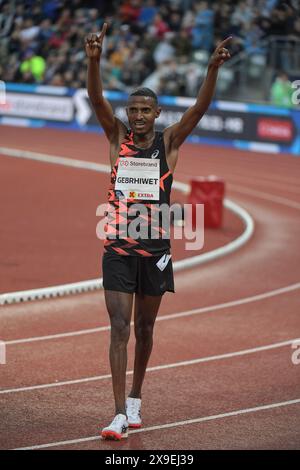 Hagos Gebrhiwet of Ethiopia celebrates his win in the men’s 5000m at ...
