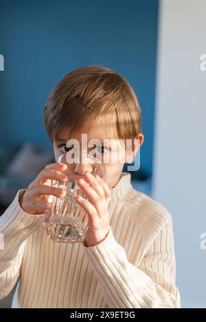 A child drinks water from a glass on the nature. Selective focus. Drink Stock Photo - Alamy