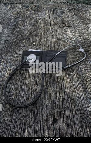 Stethoscope, wallet and money on wooden table. Healthcare, medical ...