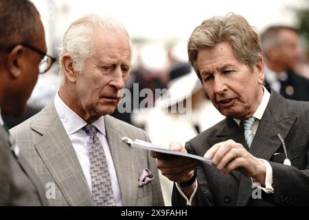 King Charles III with John Warren (left) talking to jockey Ryan Moore ...