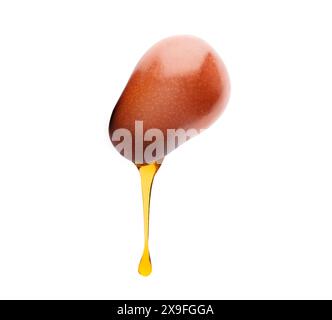 Oil dripping from palm fruit on white background Stock Photo - Alamy