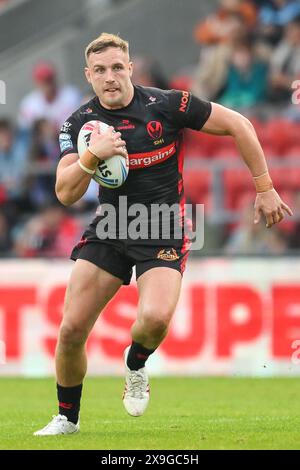 Matty Lees of St. Helens makes a break during the Betfred Super League ...