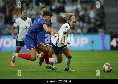 France's Elisa De Almeida, left, fights for the ball with England's ...