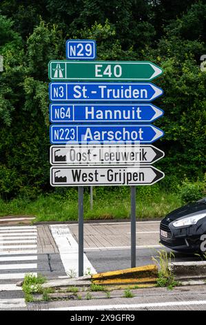 Direction signs to national roads and the E40 highway in Tienen ...