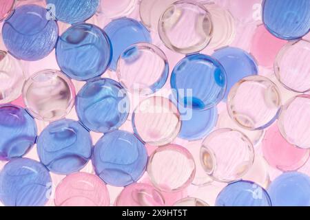 Blue, pink and transparent crowded spheres faded composing a colorful ...